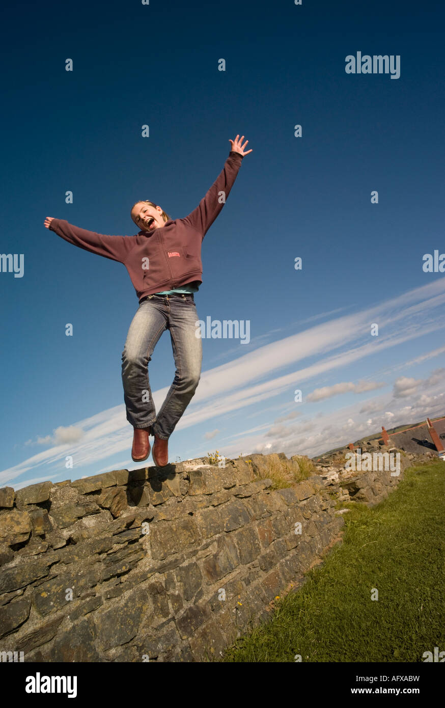 Child leaping in the air hi-res stock photography and images - Alamy