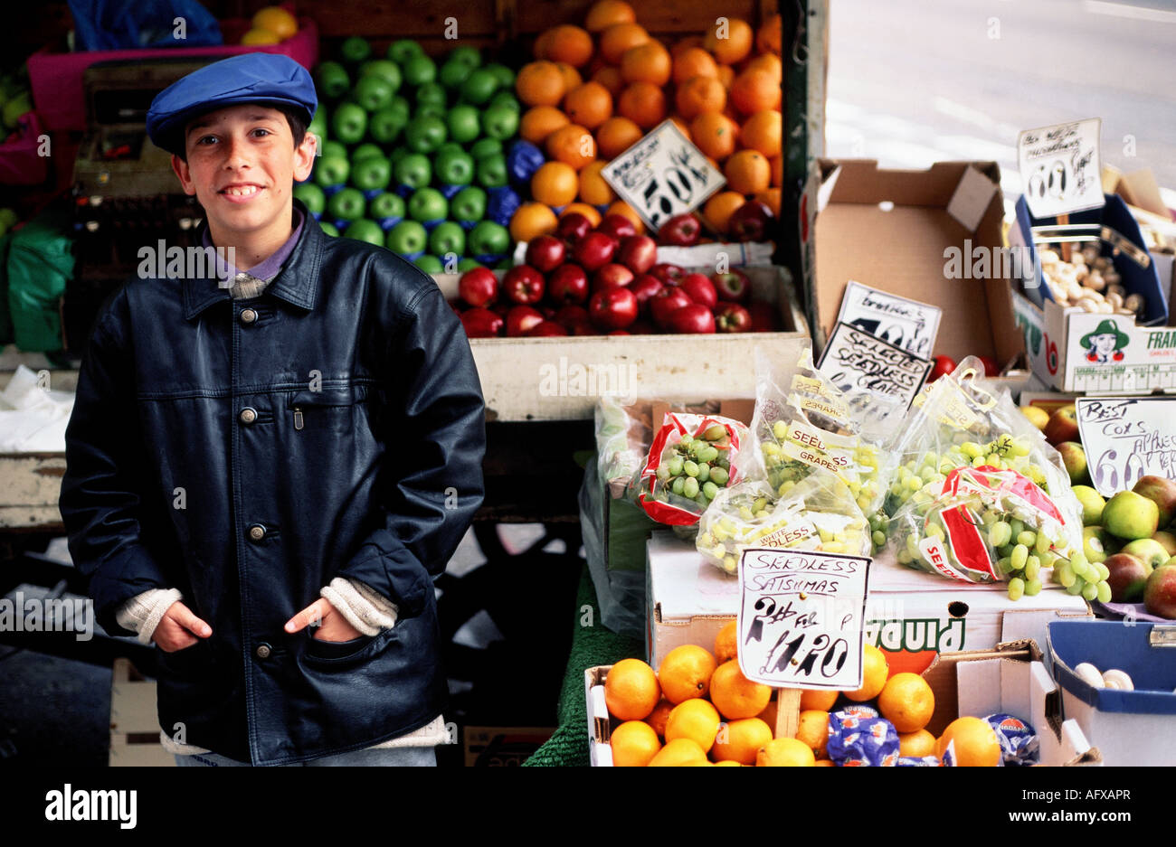 Young boy selling fruit and vegetables London UK Stock Photo - Alamy
