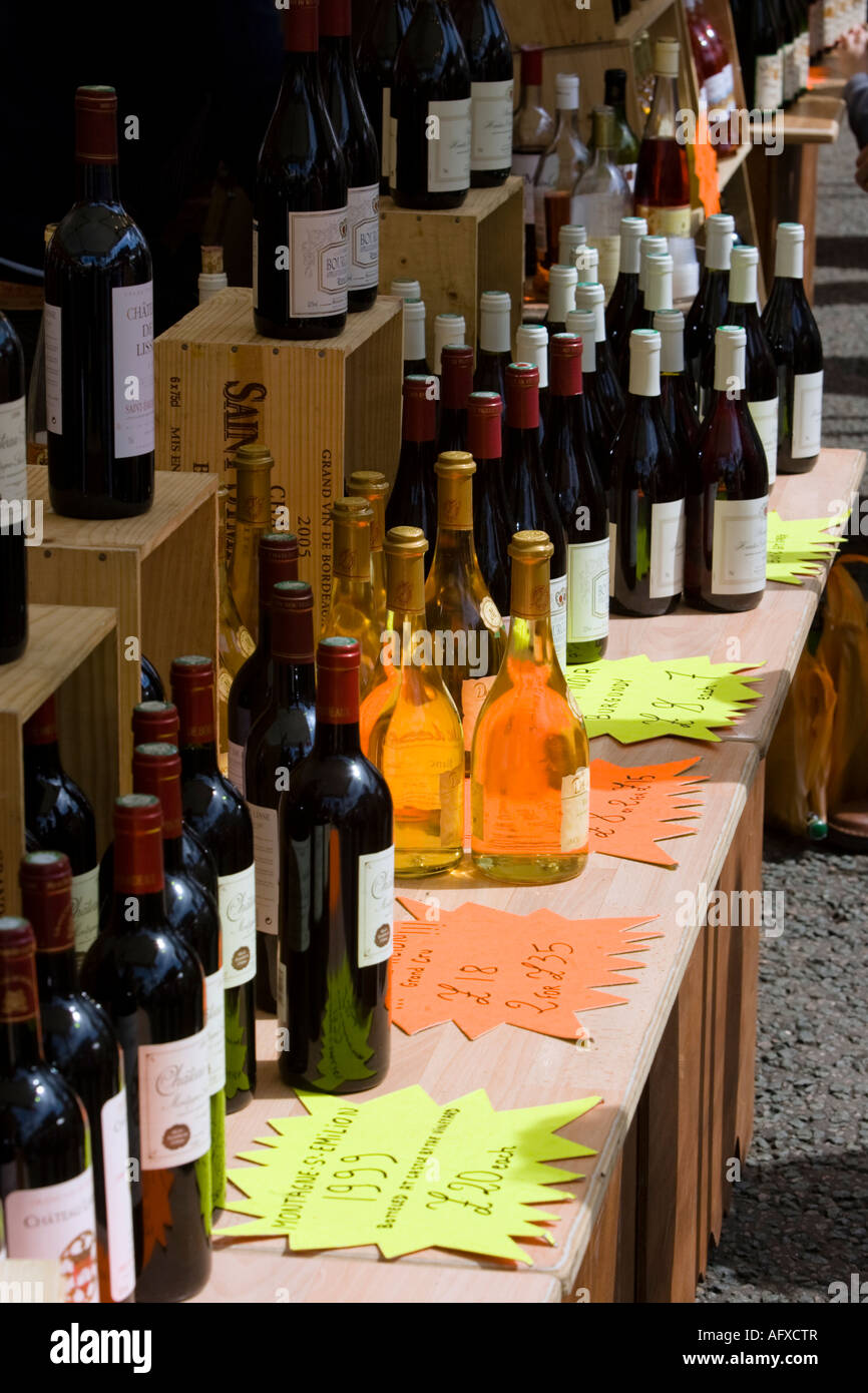 Rows of bottles of French wine for sale on stall during open air French ...