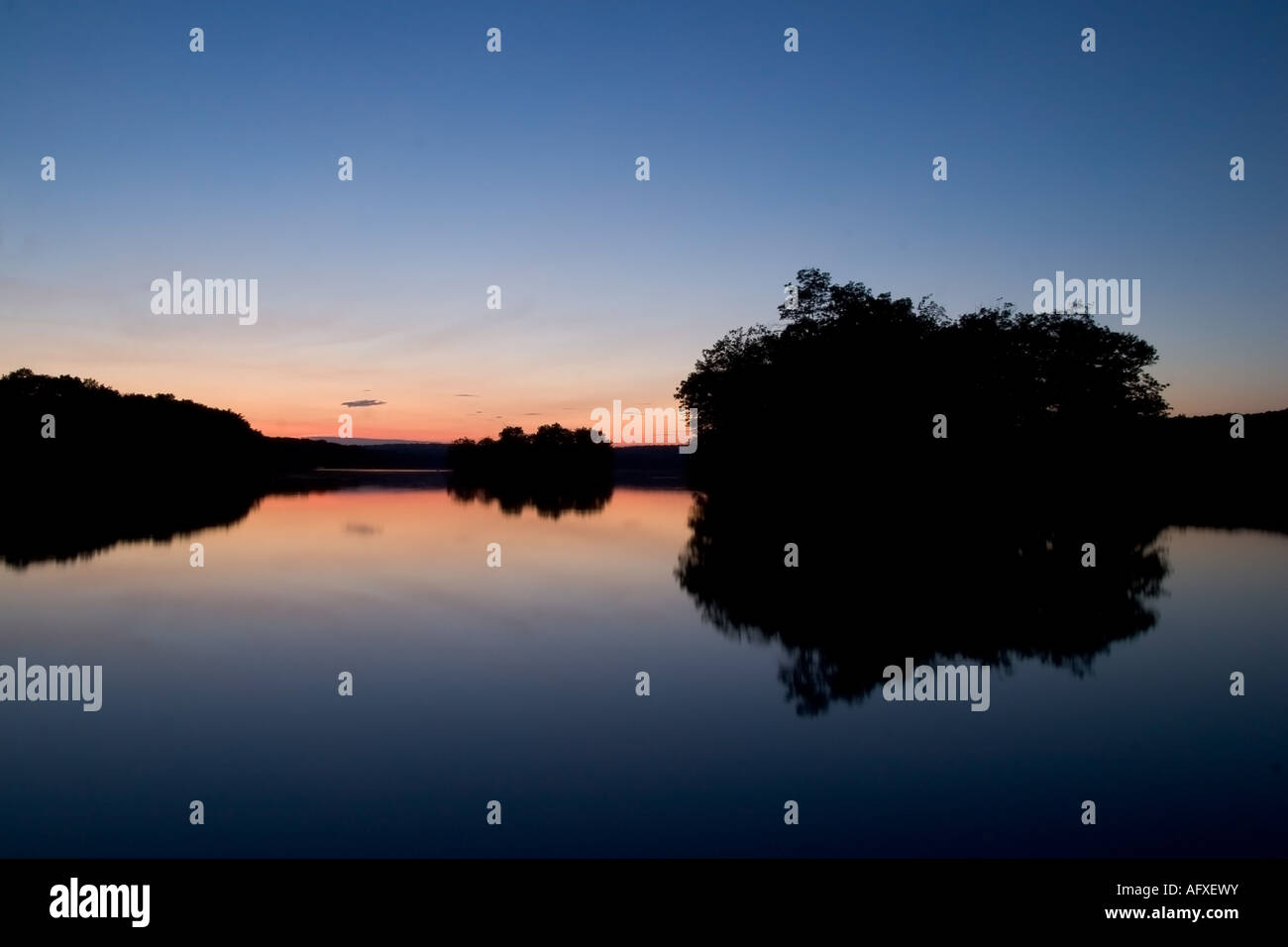 Sunset over Lake Williams in Lebanon, Connecticut USA with the sky and ...