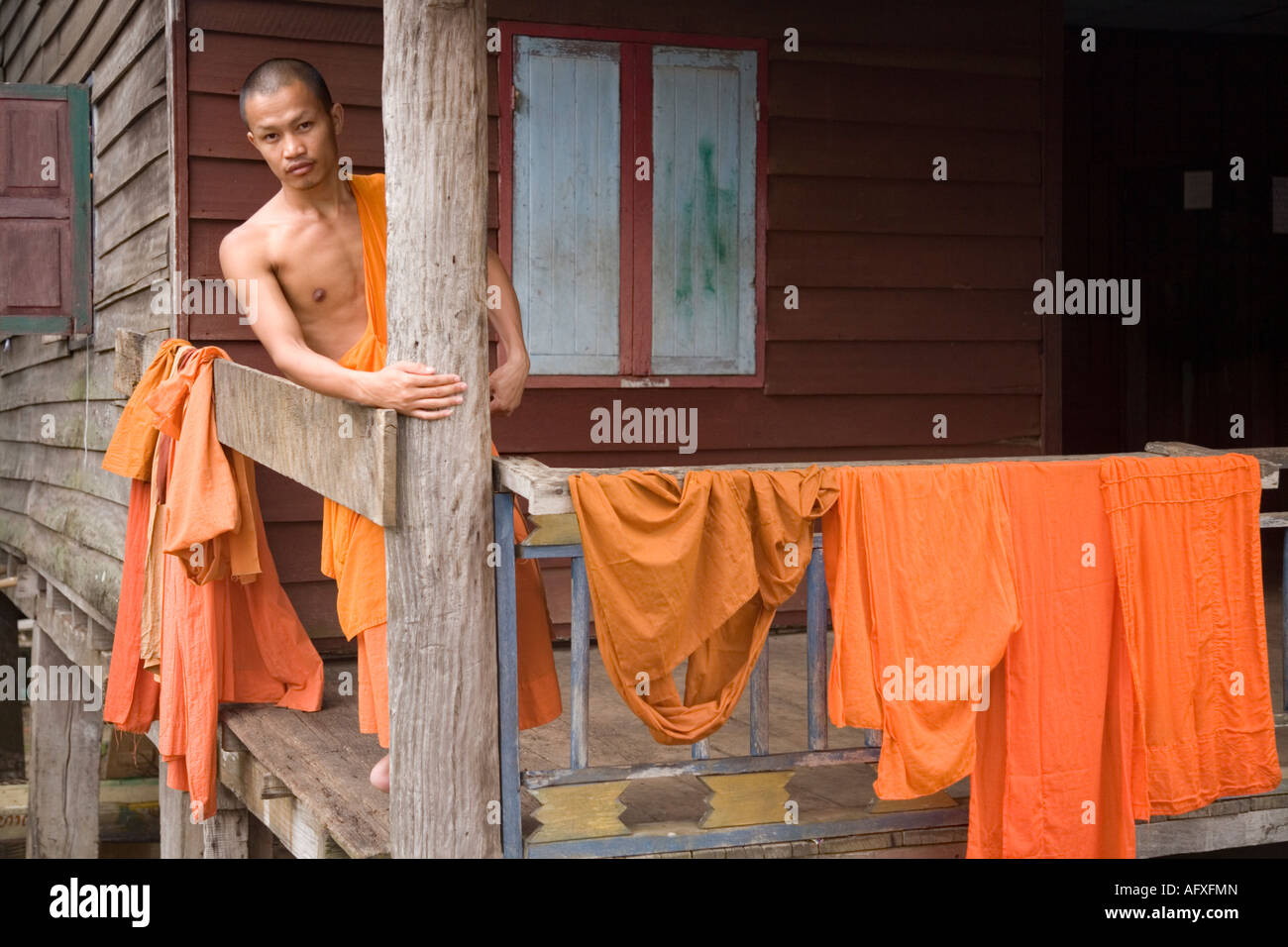 monk with drying washing at Wat Si Vieng Song (Wat That) Vang Vieng ...