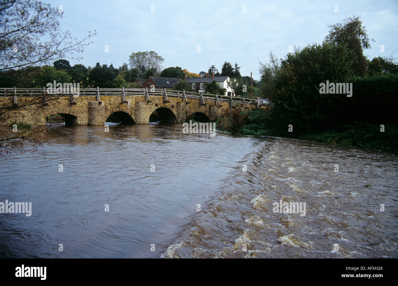 TILFORD SURREY England UK November The River Wey in flood flowing under ...