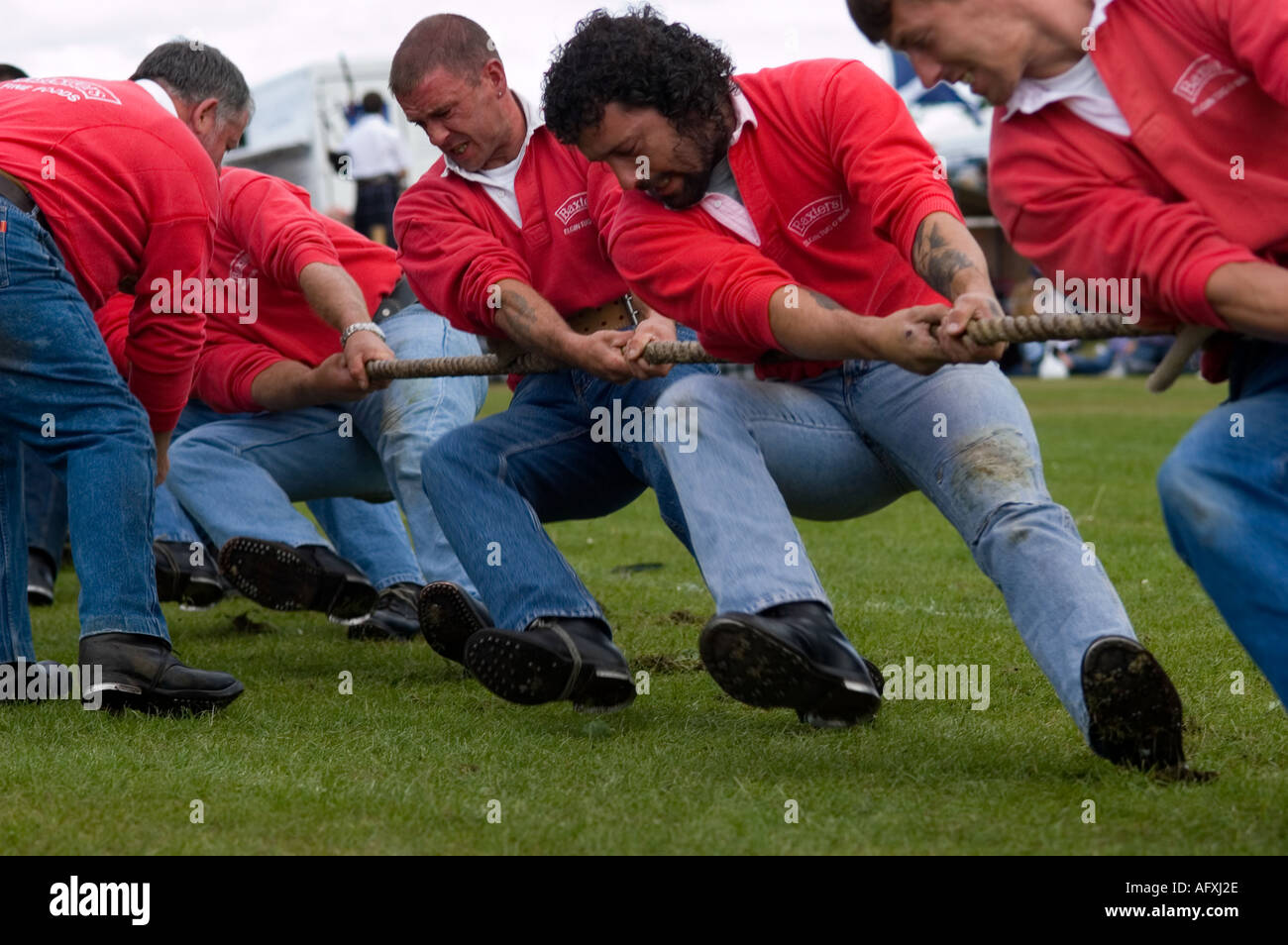 Victorious Tug of war team from Baxters of Elgin with coach shouting ...