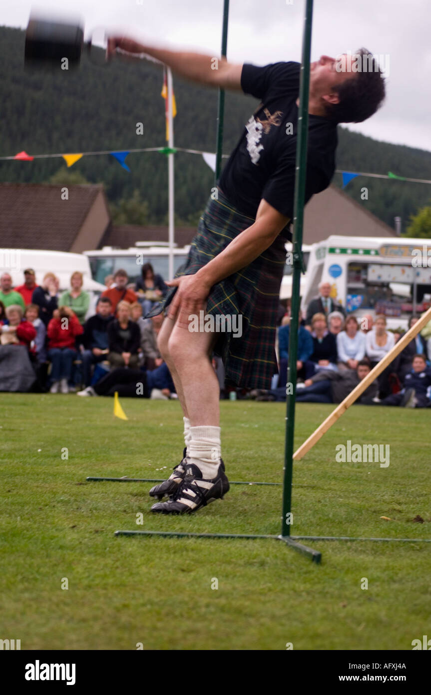 Throwing the weight over the bar Stock Photo - Alamy
