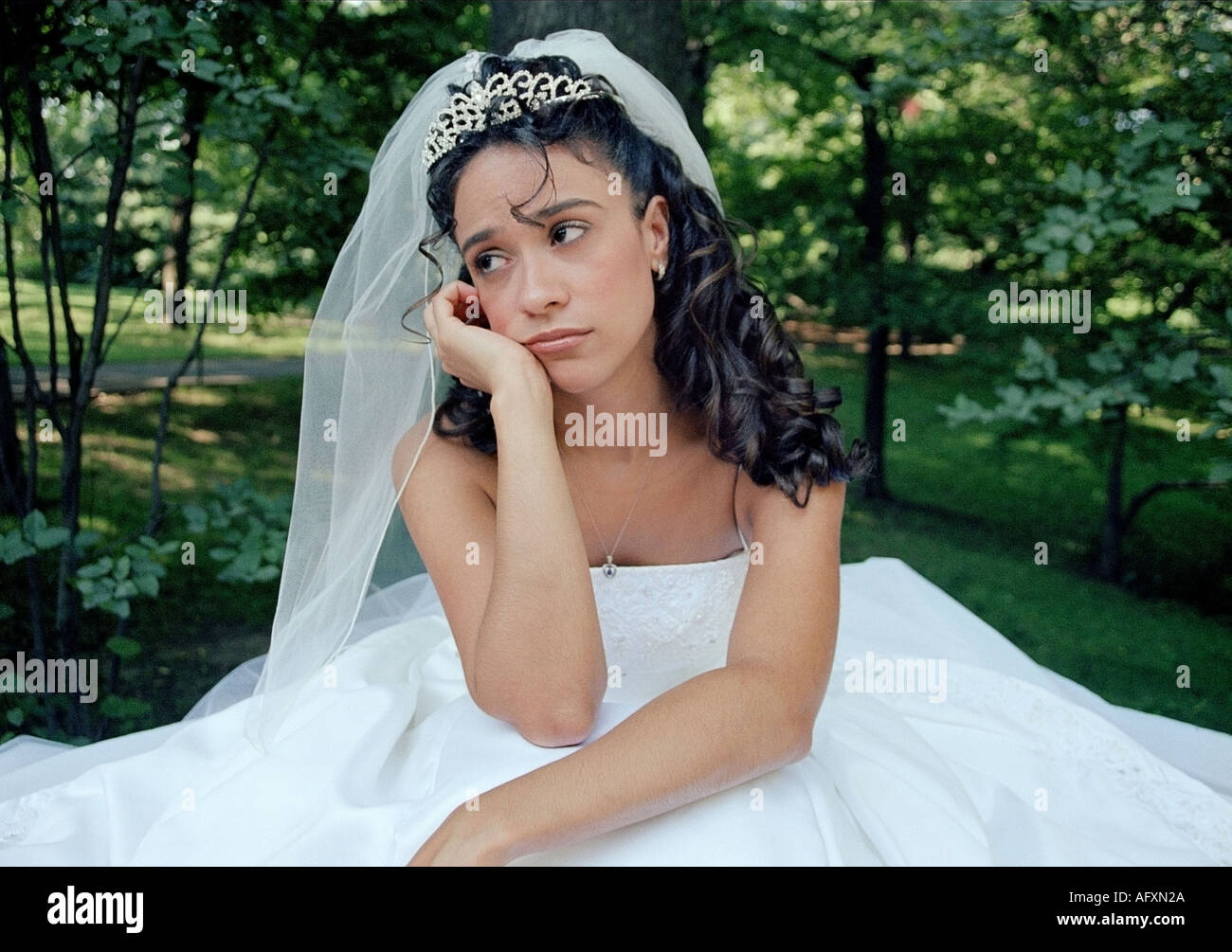 Sad looking beautiful young bride Stock Photo - Alamy