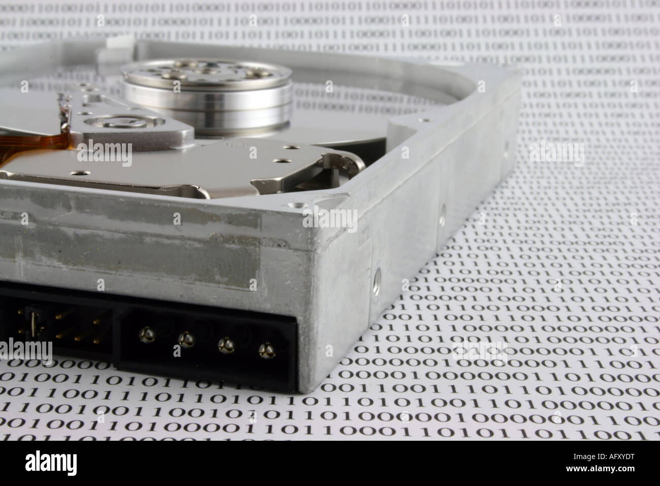 An open Hard disk with a background of binary numbers Stock Photo - Alamy