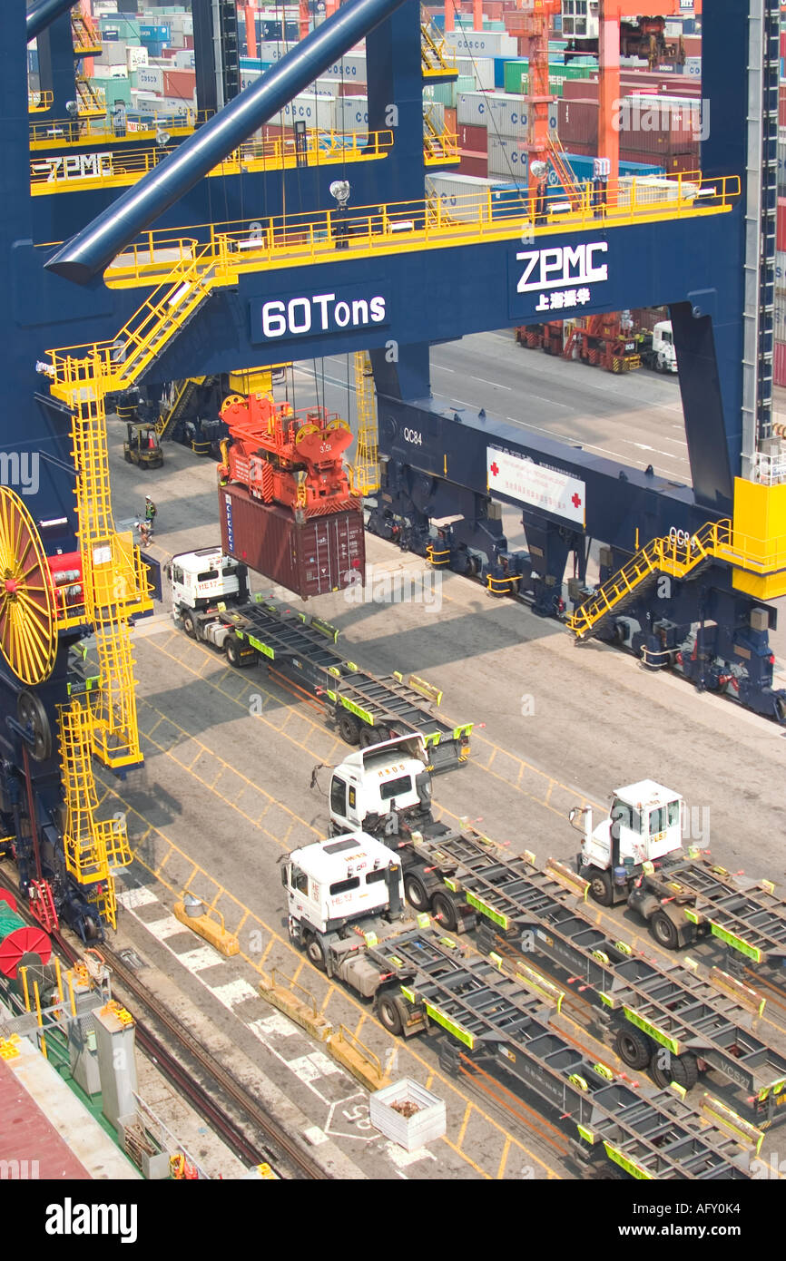 Container Shipping Trucks line up on dock to receive unloaded ...
