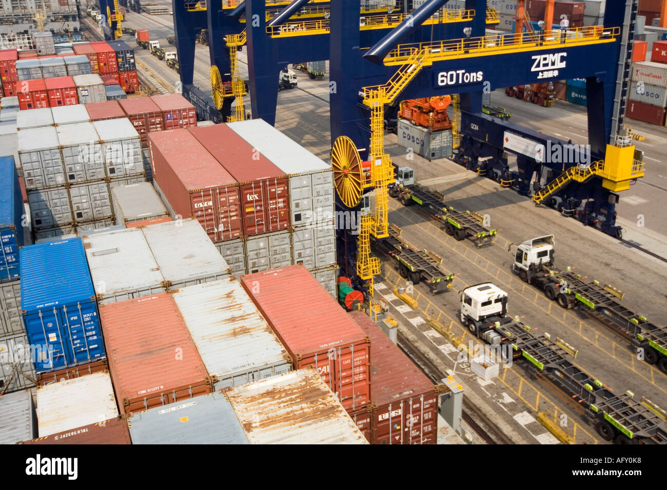 Container Shipping Trucks line up on dock to receive unloaded ...