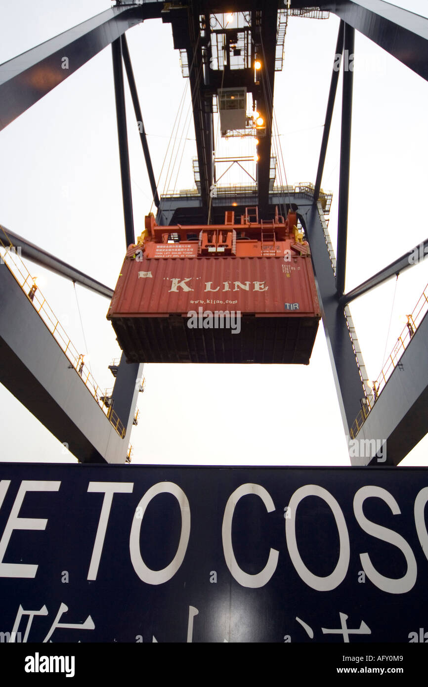 Overhead heavy lift container shipping crane lifting 20' container ...