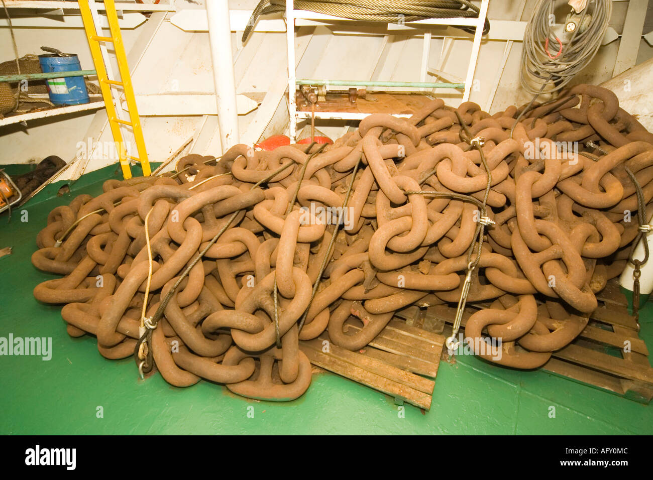 Anchor chain massive pile in bow of container ship rusty Stock Photo ...