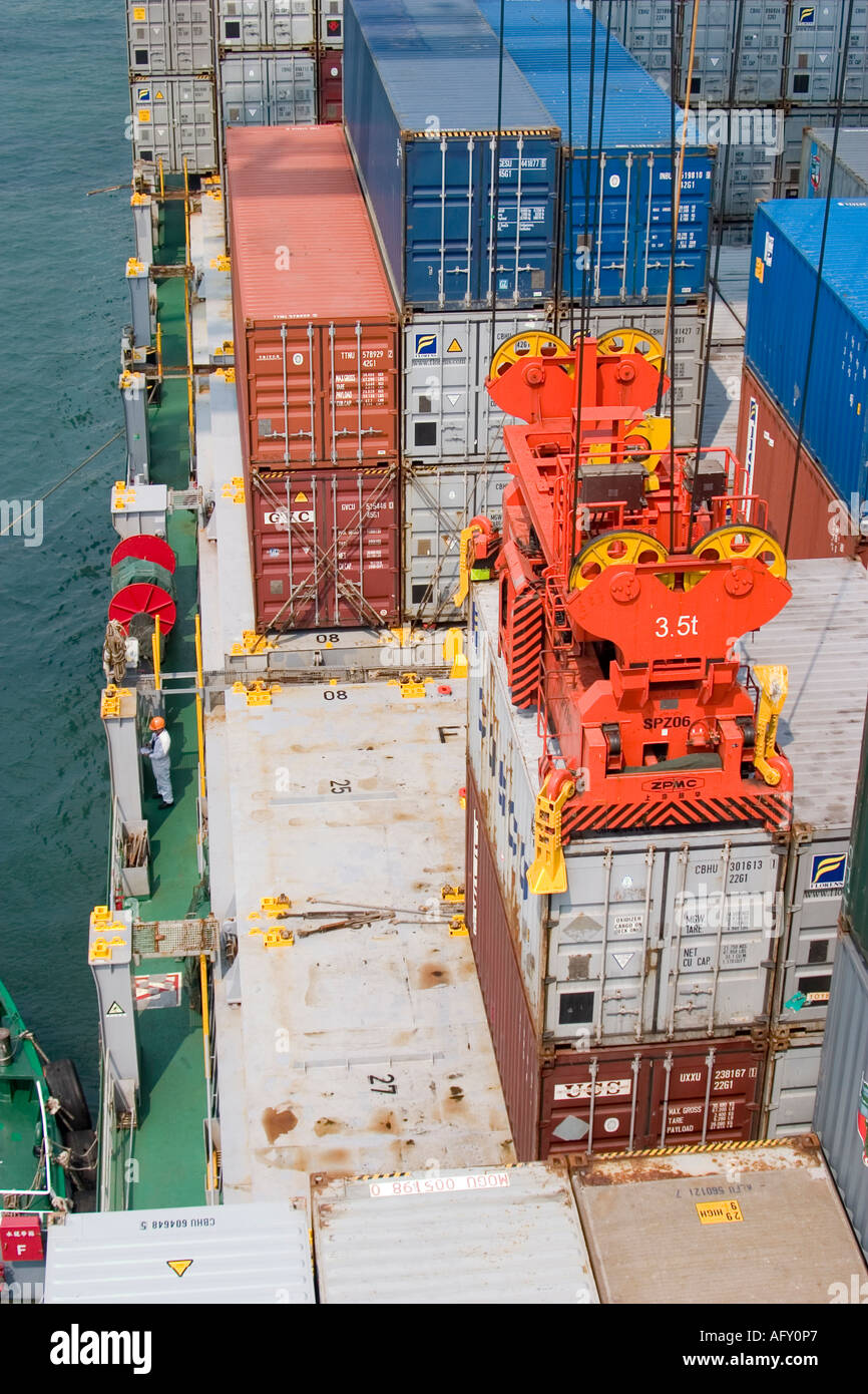 Container ship heavy lift cranes unloading container ship Stock Photo ...