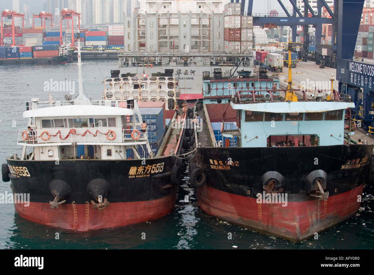 River barges loading containers at kwai Chung port Stock Photo - Alamy