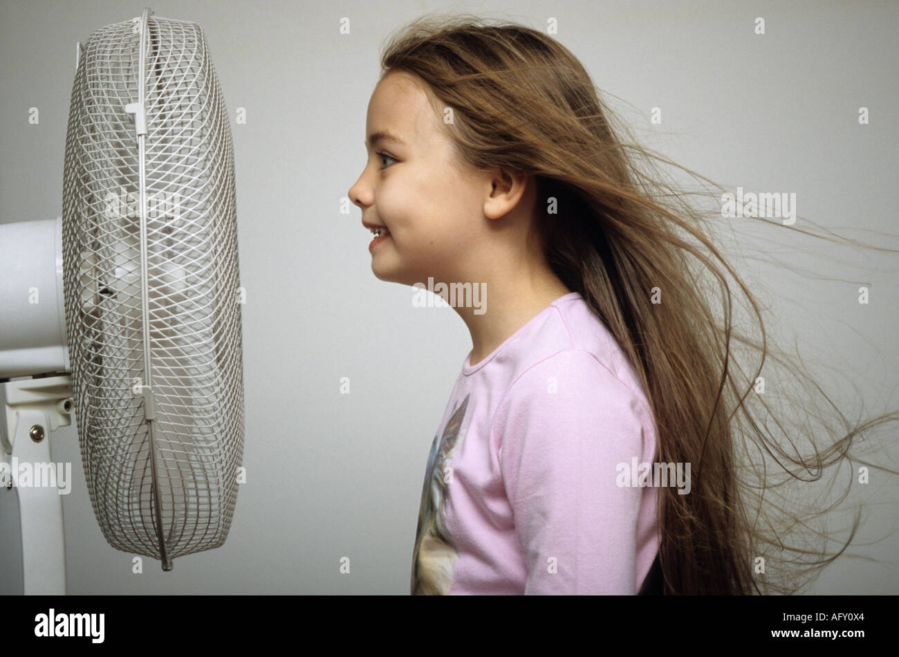 Fan blowing hair hi-res stock photography and images - Alamy