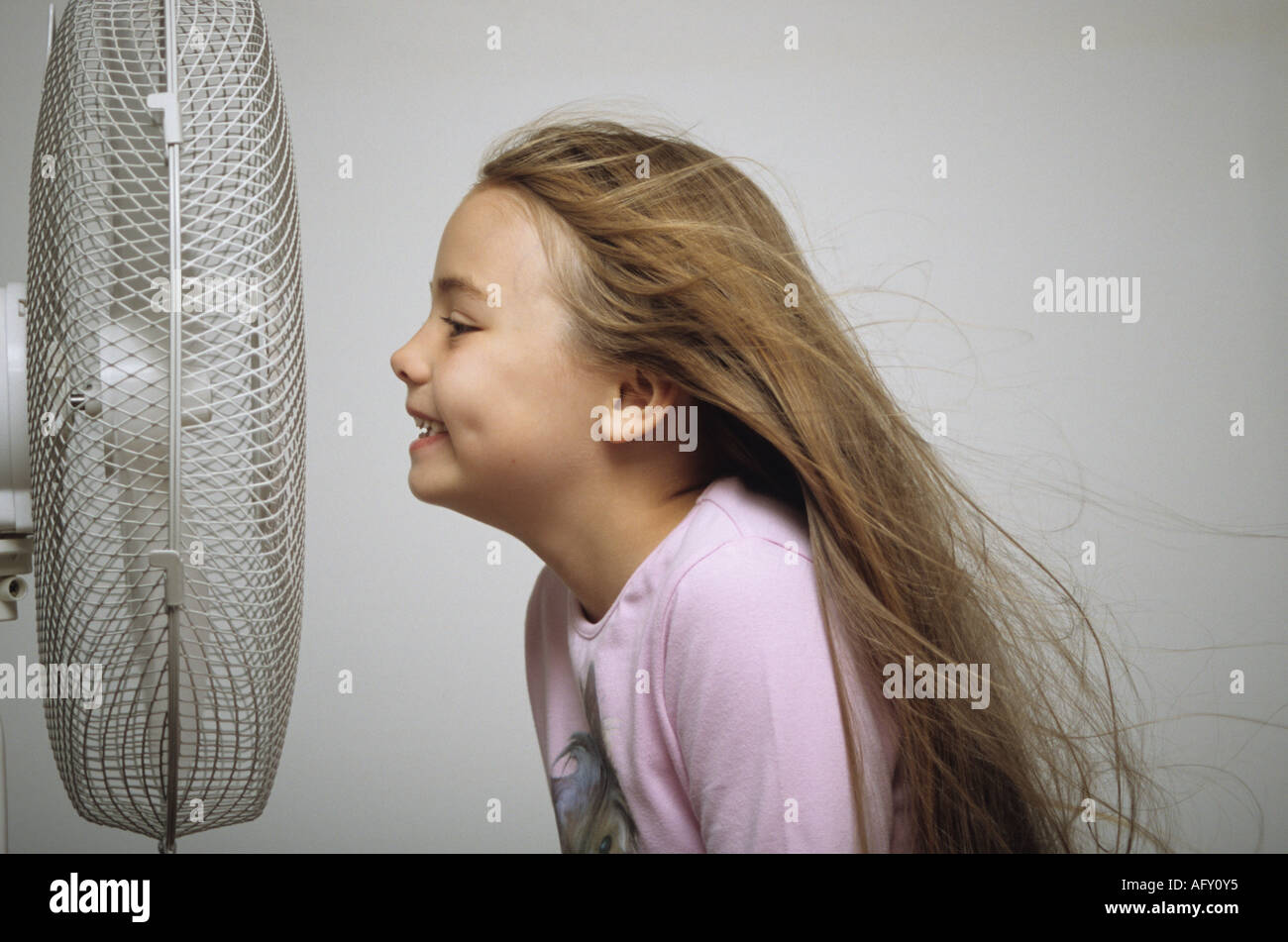 Fan blowing hair hi-res stock photography and images - Alamy