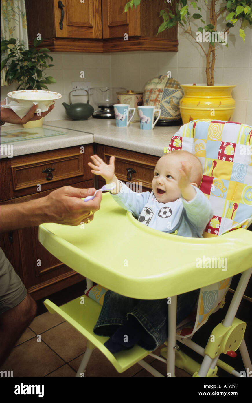 Baby With Arms Raised Stock Photo - Alamy