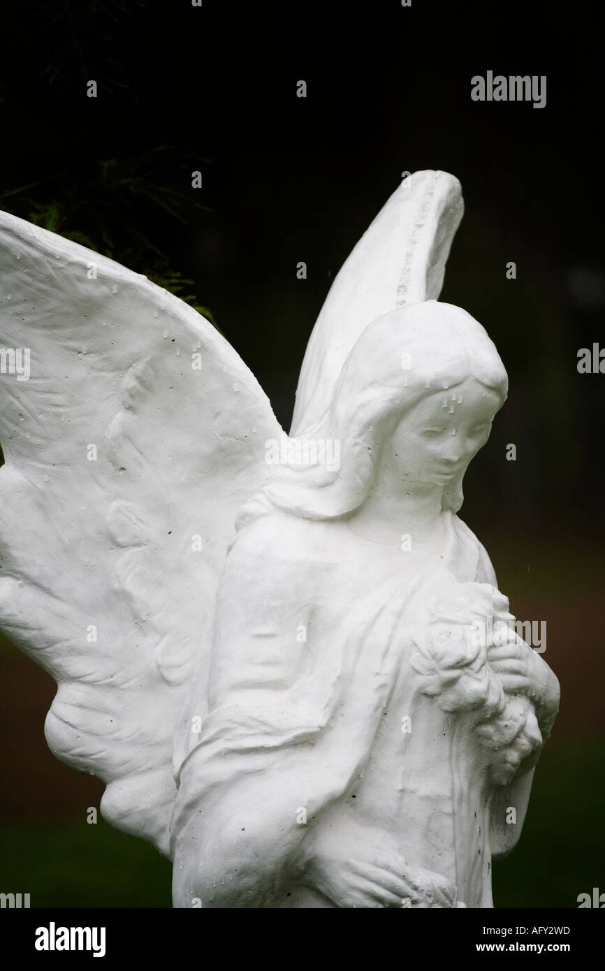 Angel statue wet from rain Stock Photo - Alamy