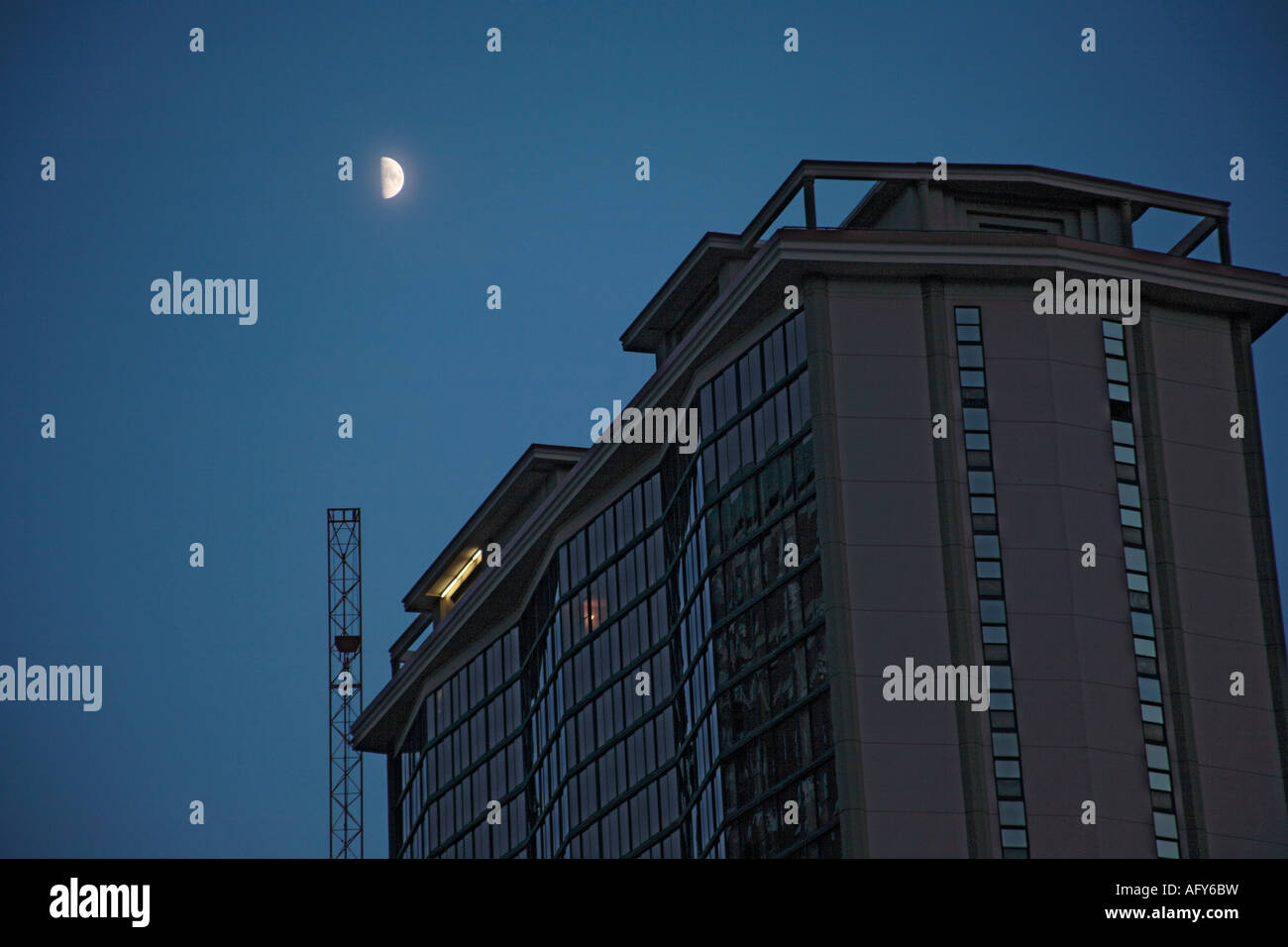Building at Night with Moon Stock Photo - Alamy