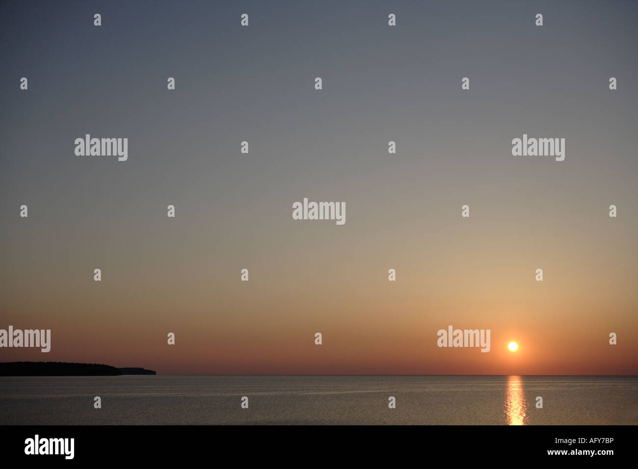 sunset over lake michigan rock island state park wisconsin Stock Photo ...