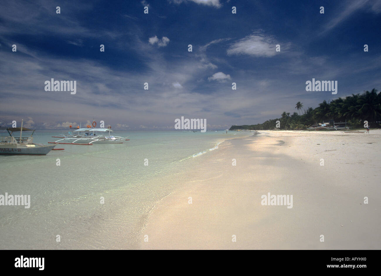 the brightly painted boats at the spectacular Boracay beach Island in ...