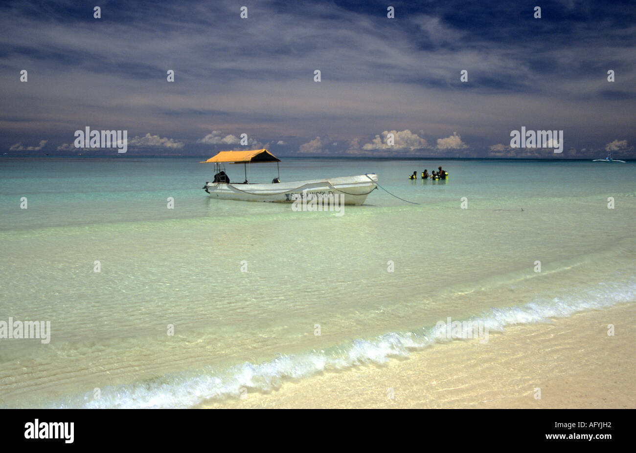 One of the brightly painted boats at the spectacular Boracay beach ...