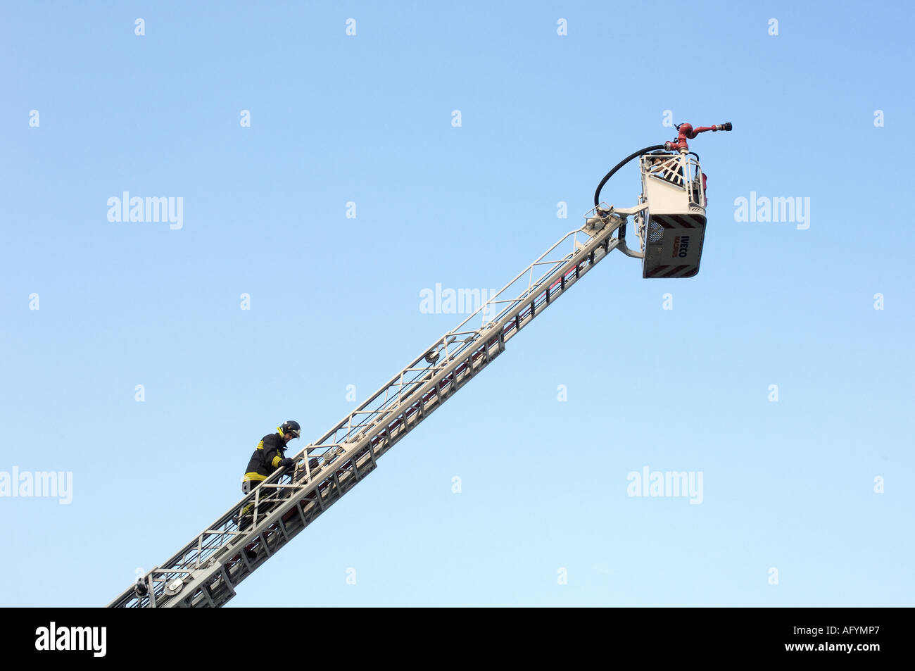 Firemen using water cannon Stock Photo - Alamy