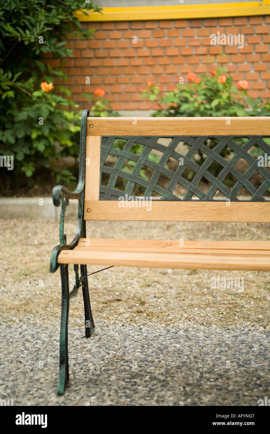 Half bench in a small garden Stock Photo - Alamy