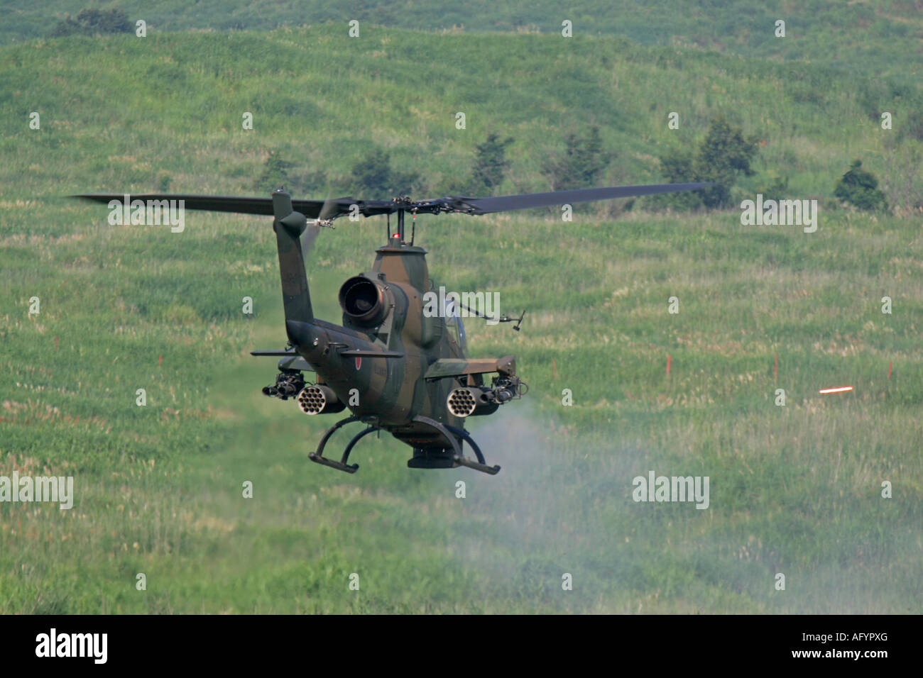 Japan Ground Self Defence Force AH-1 Cobra helicopter firing 20mm ...