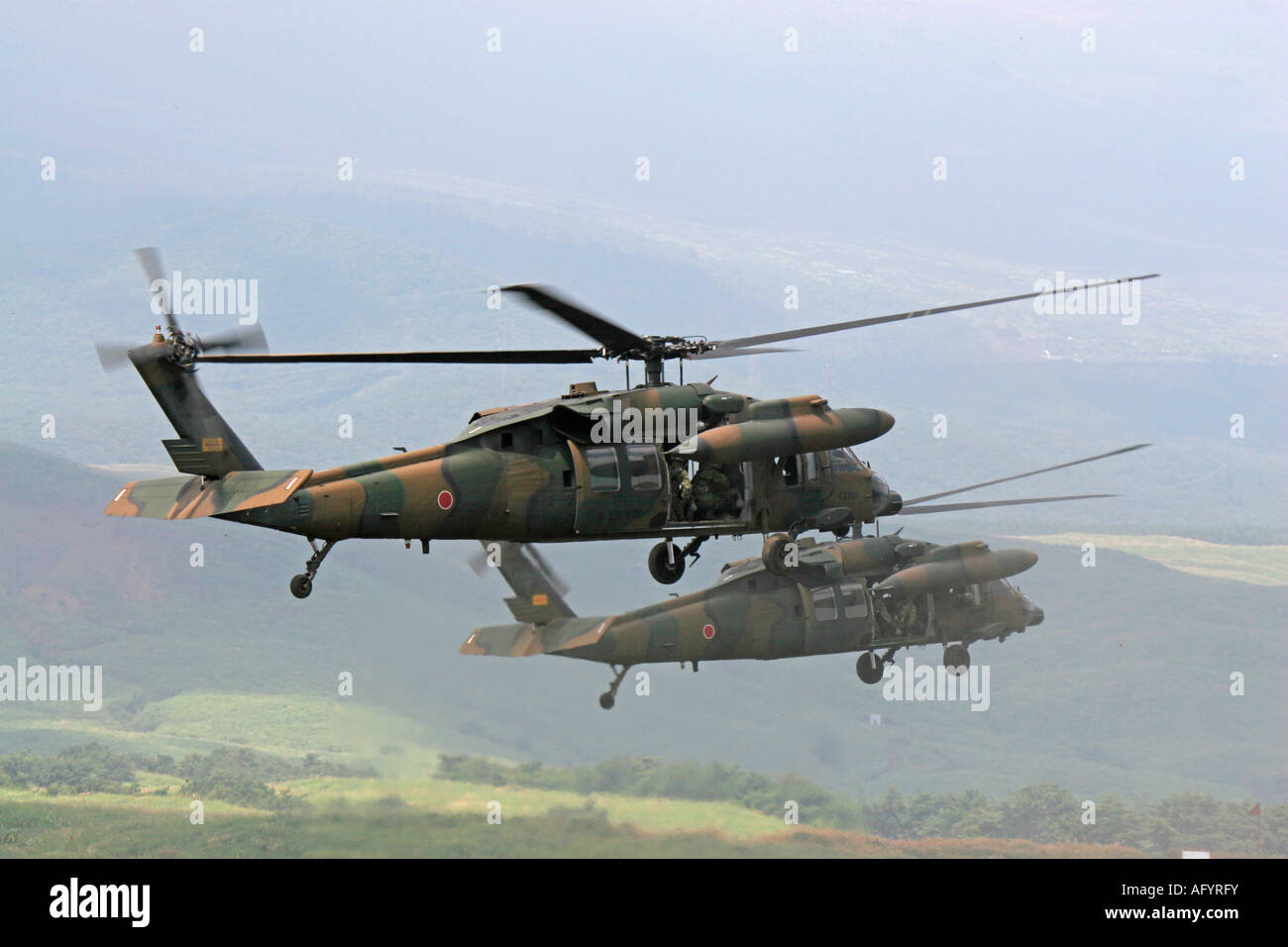 Formation flight of two SikorskyUH-60JA Black Hawk helicopters of Japan ...