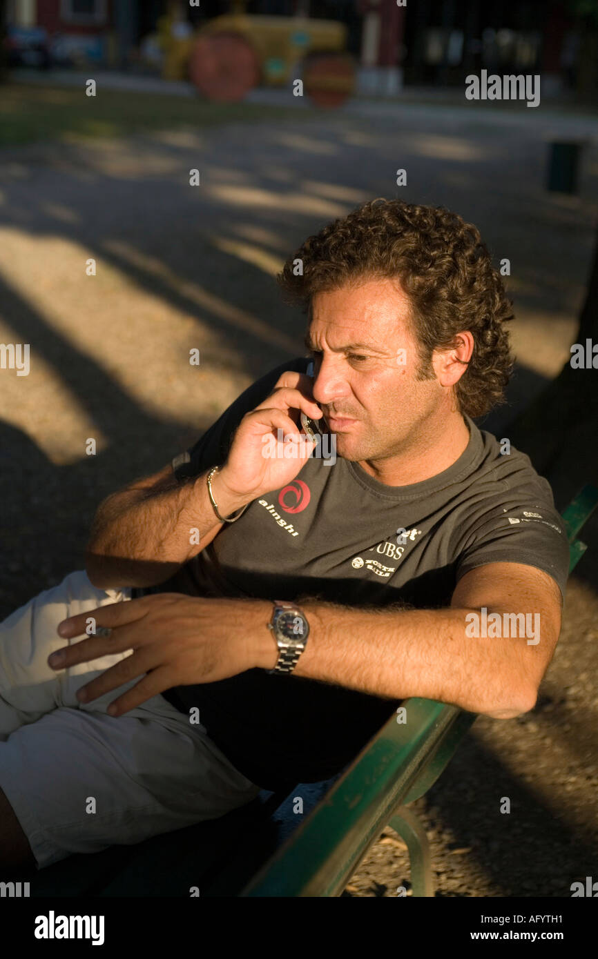 Man having a serious conversation on the phone outdoor Stock Photo - Alamy