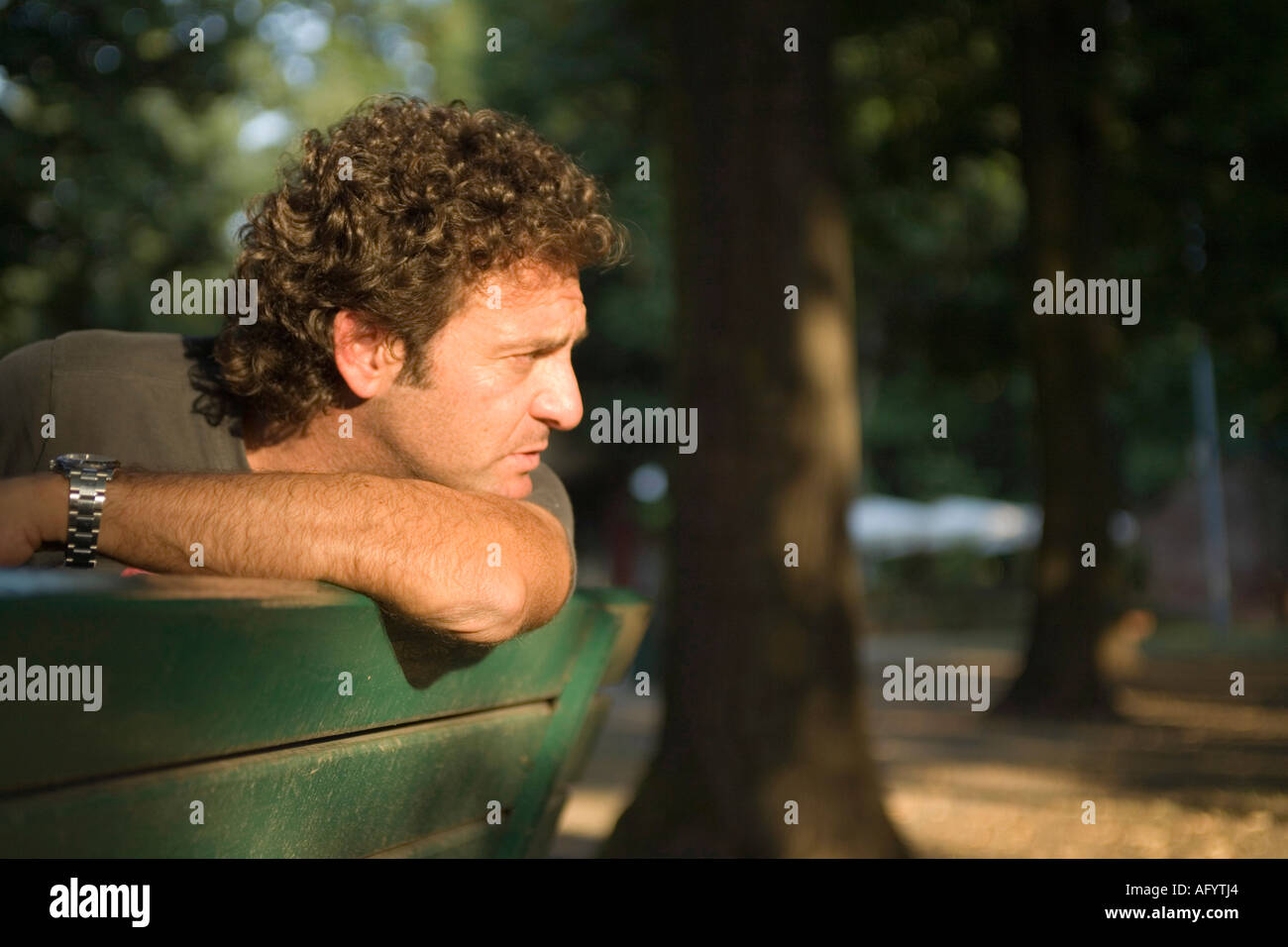 Solitary man lost in memories of the past Stock Photo - Alamy