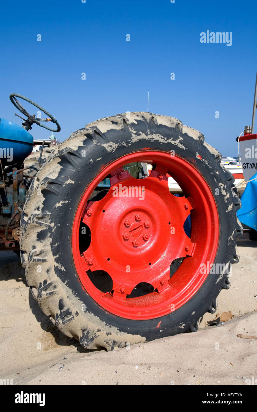 The Old Red wheel on the tractor of the Cromer fishermen Stock Photo ...