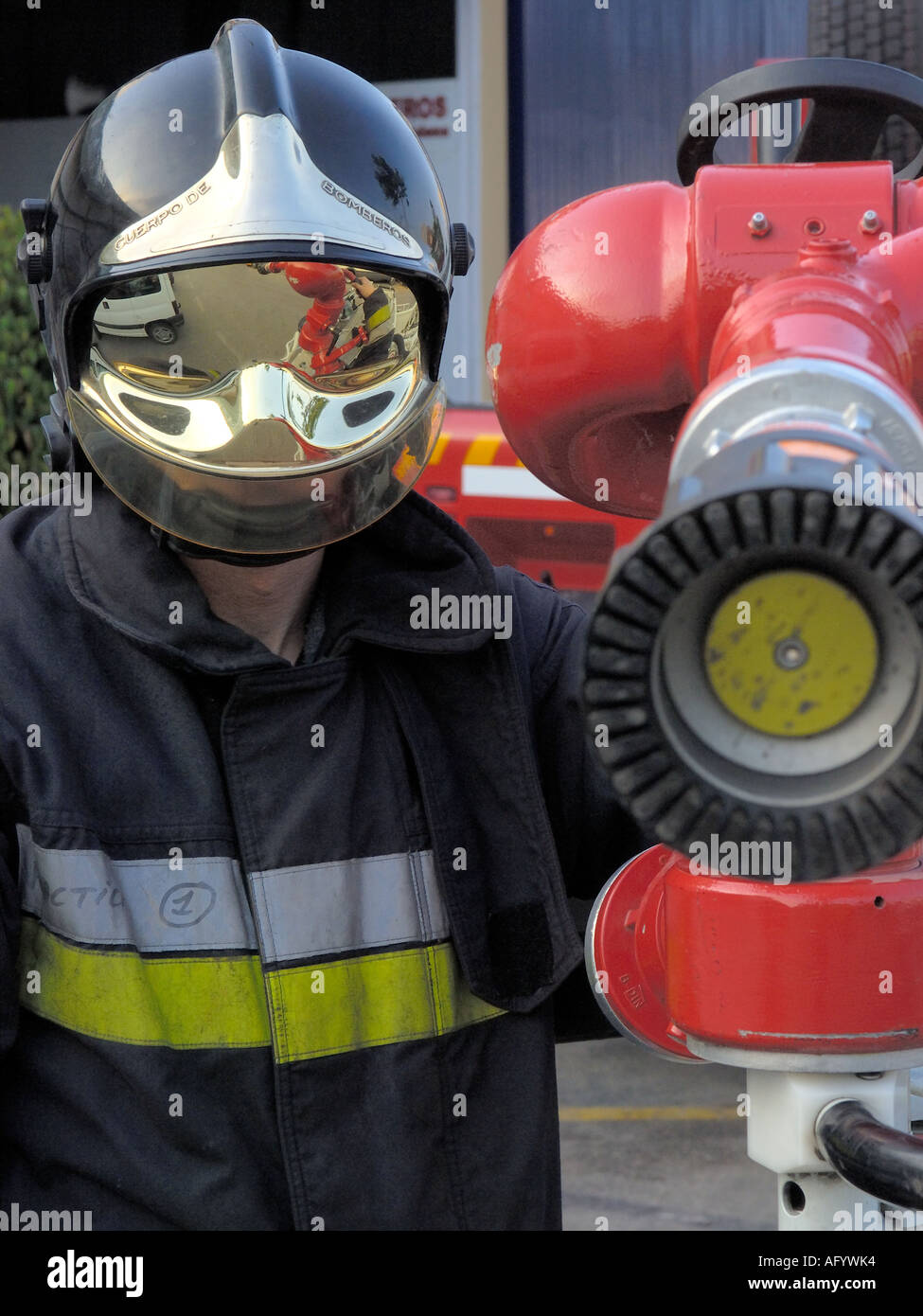 Firemen using water cannon Stock Photo - Alamy