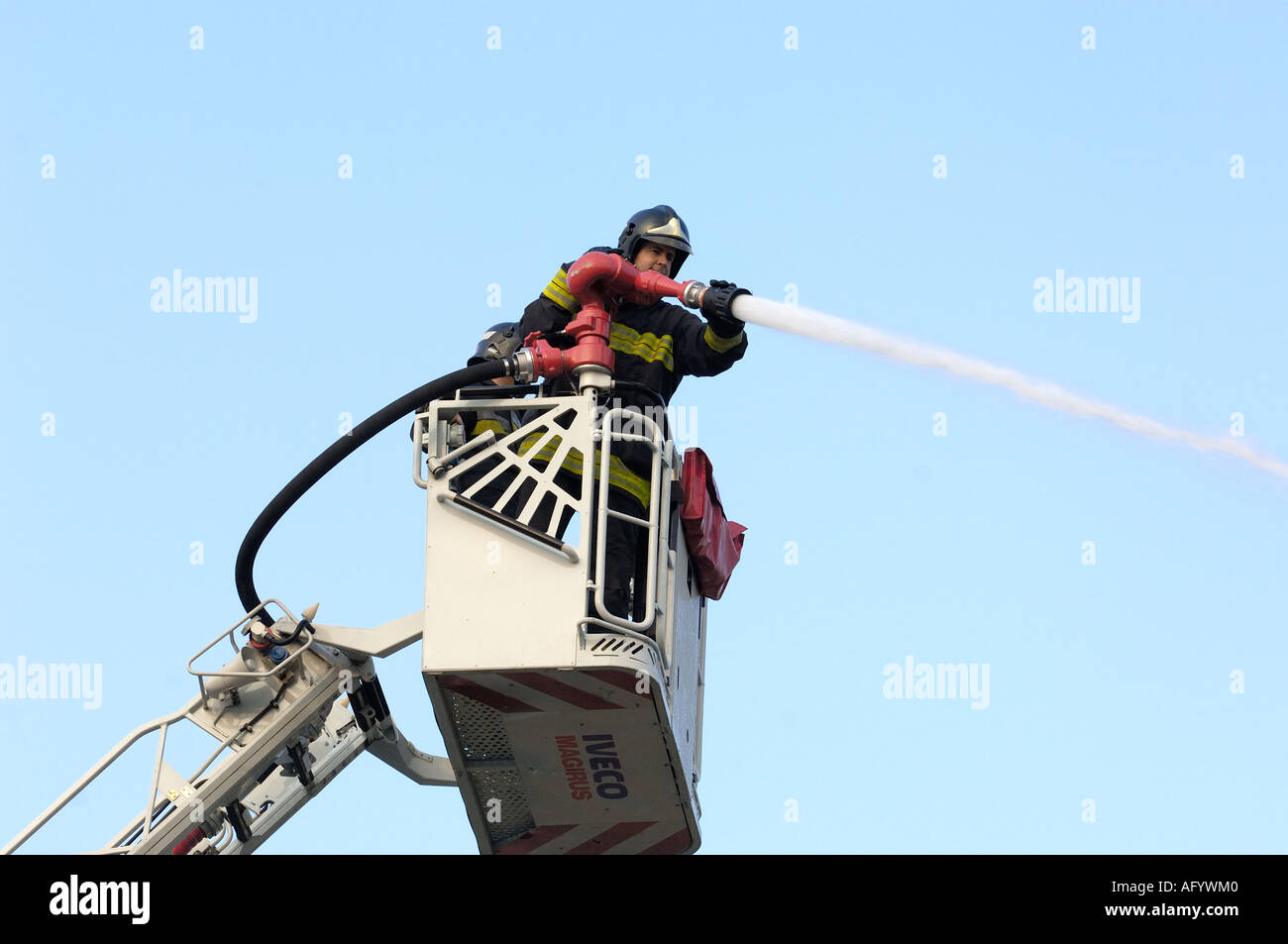 Firefighters using ladders hi-res stock photography and images - Alamy