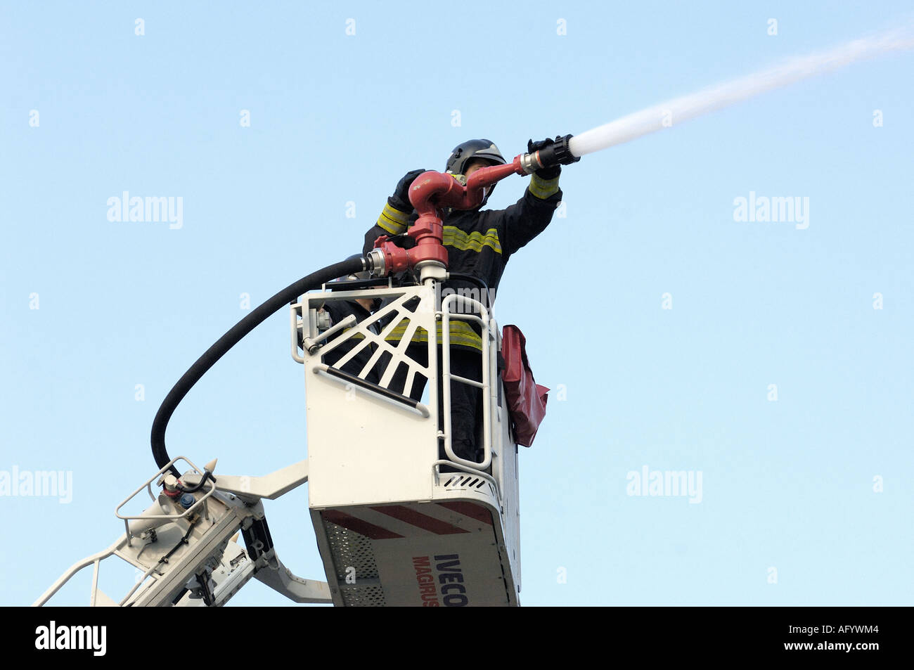 Firefighters using ladders hi-res stock photography and images - Alamy