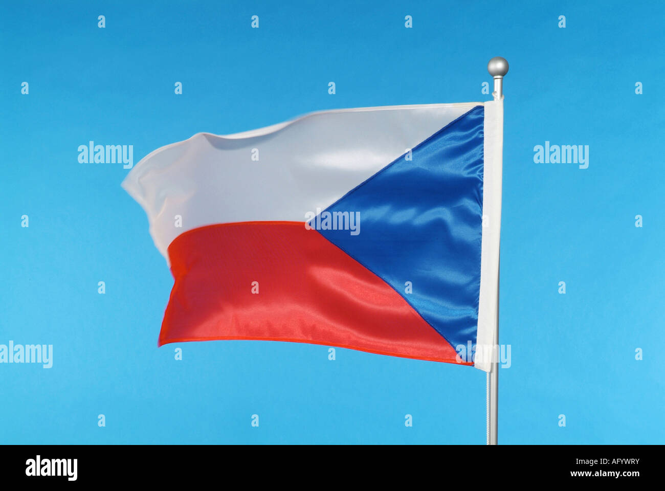 Czech national flag against blue sky Stock Photo - Alamy