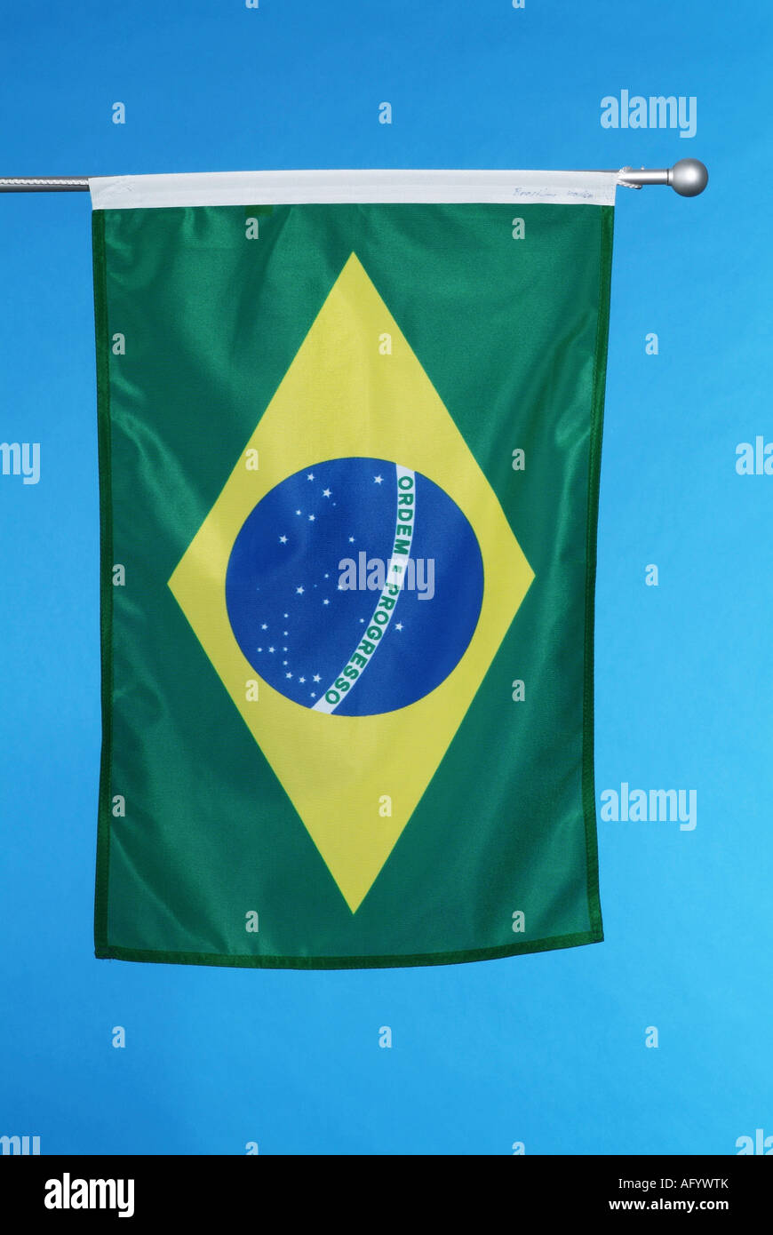 Brazilian national flag against blue sky Stock Photo - Alamy