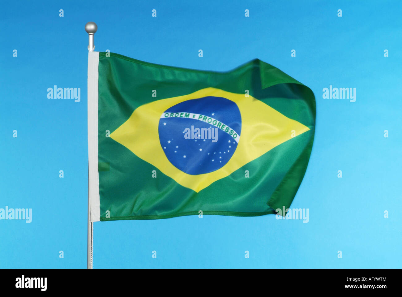 Brazilian national flag against blue sky Stock Photo - Alamy