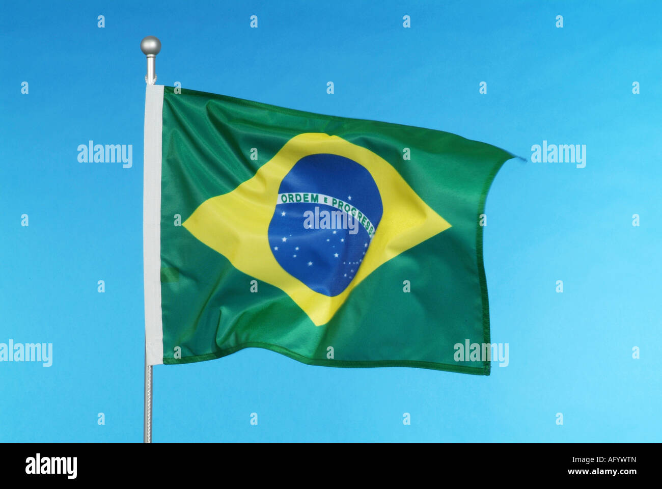Brazilian national flag against blue sky Stock Photo - Alamy