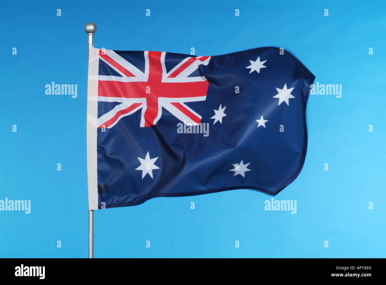 Australian national flag against blue sky Stock Photo - Alamy