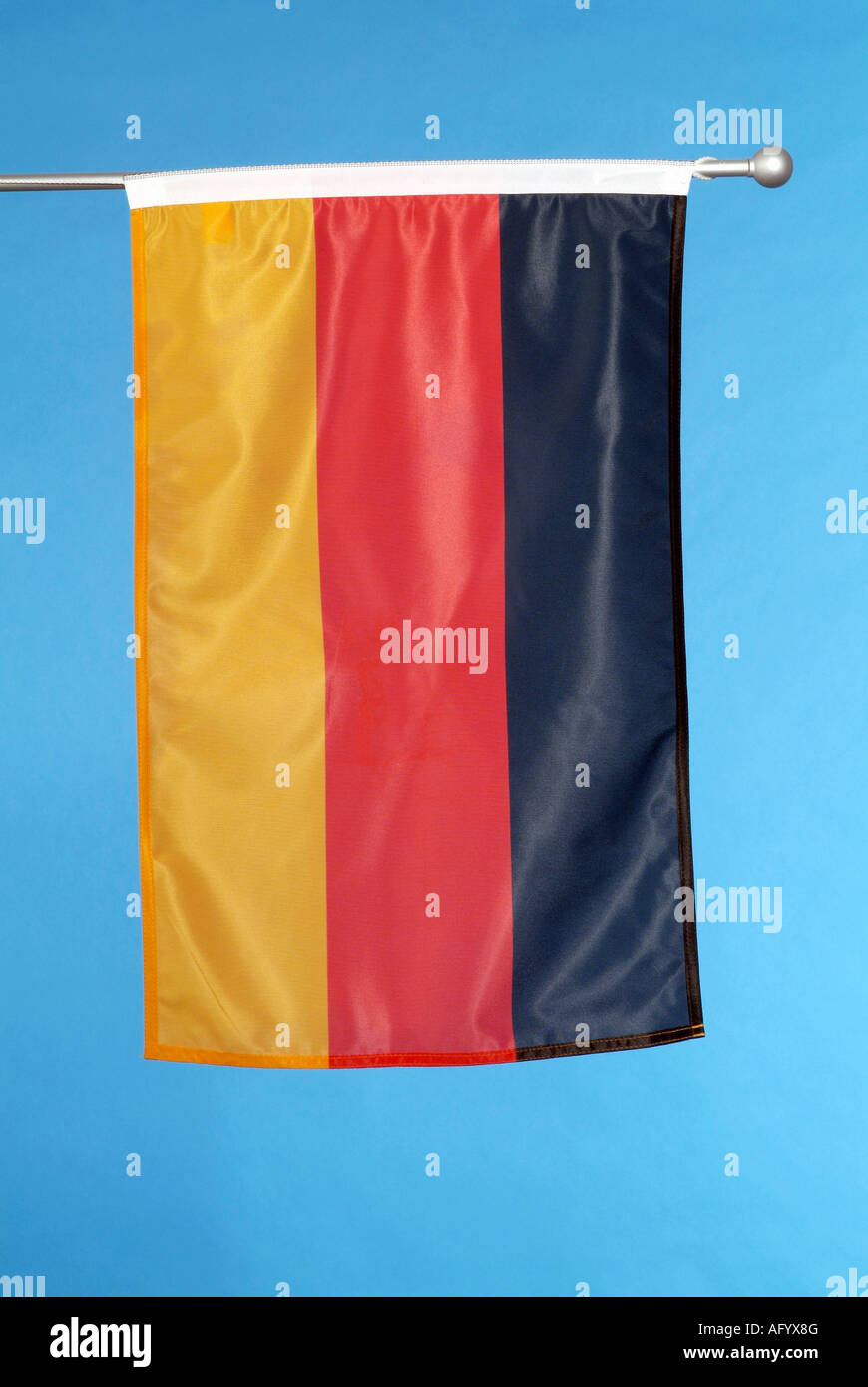 Germany national flag against blue sky Stock Photo - Alamy