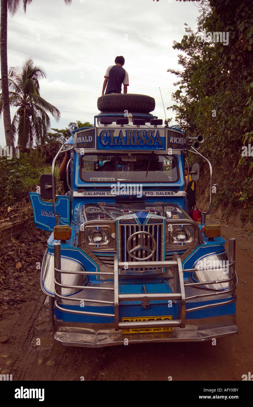 man standing on top of a jeepney Stock Photo - Alamy