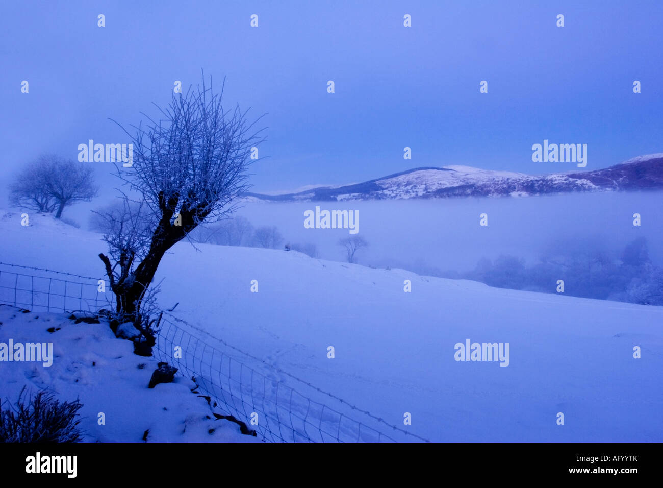 A blue tinged snowy scene, Sarnau, Gwynedd, Wales March 2006 Stock ...