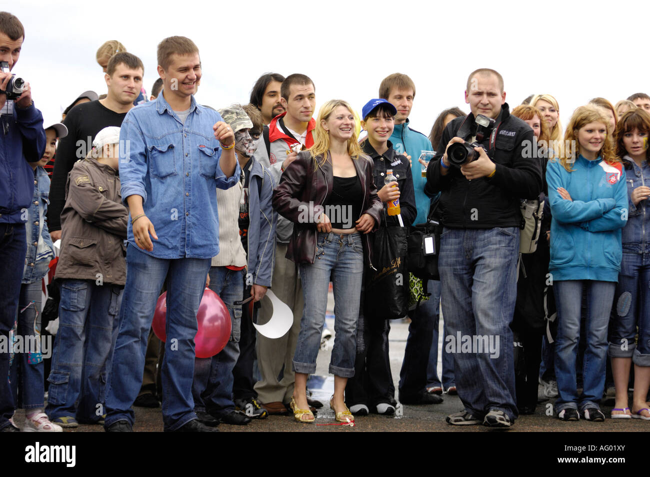 Crowd of people having fun watching show on the street Stock Photo - Alamy