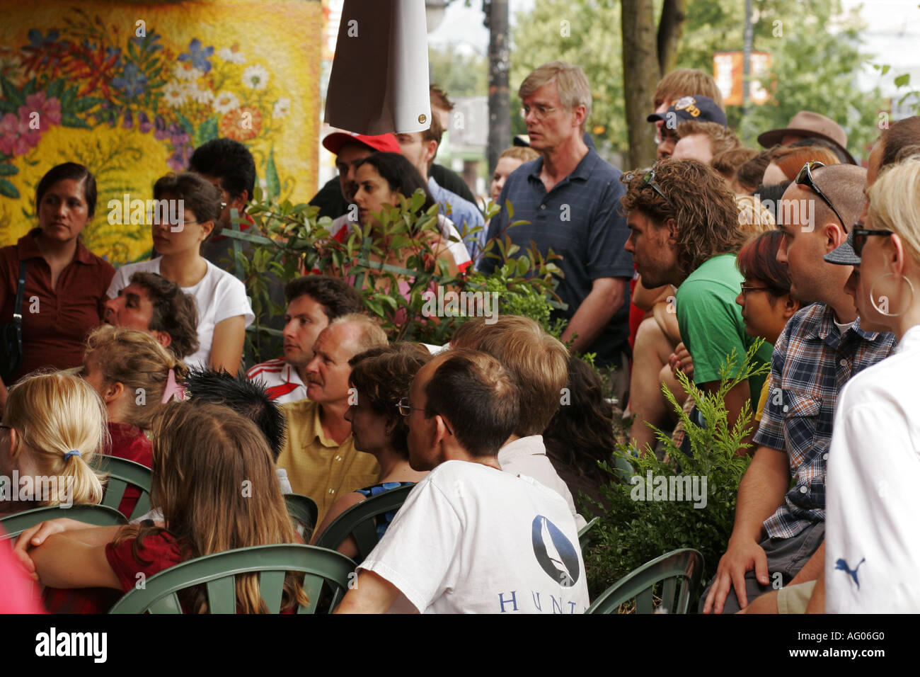 Soccer fans watching the game Stock Photo - Alamy