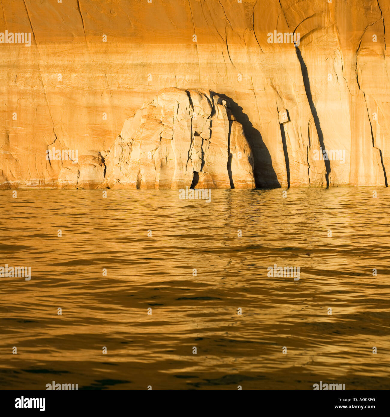 Sandstone rock cliff at water level, lake powell Stock Photo - Alamy