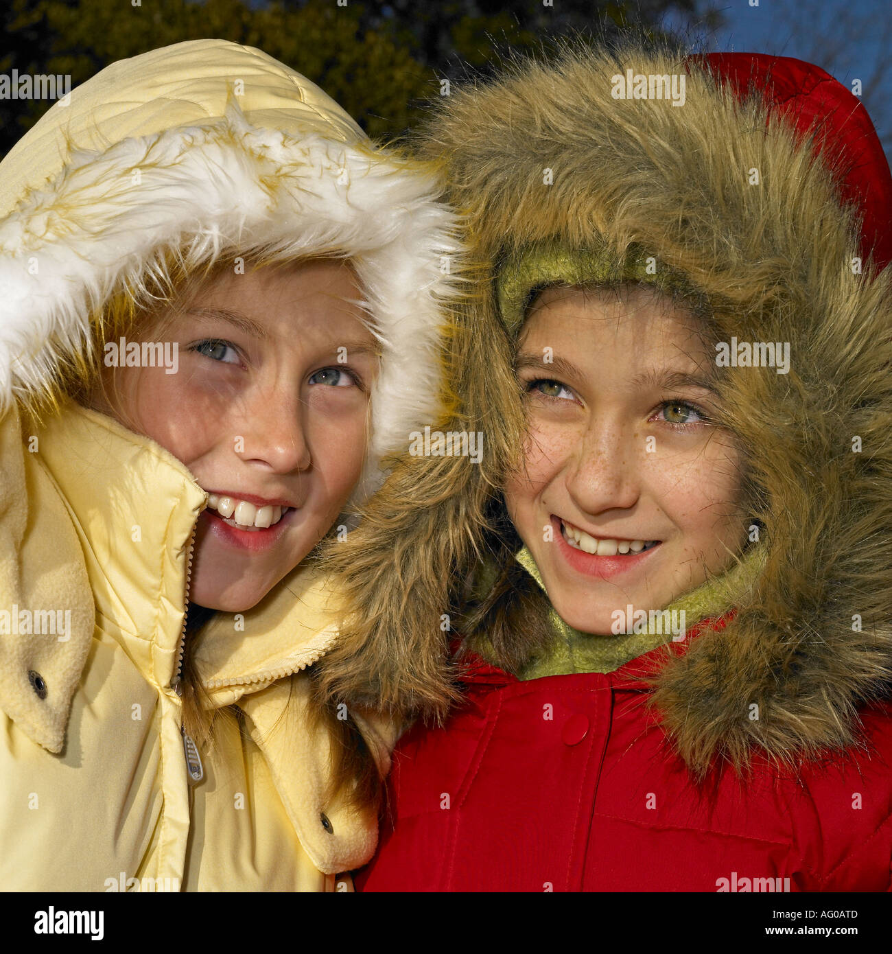 Portrait of two girls in winter coats Stock Photo - Alamy