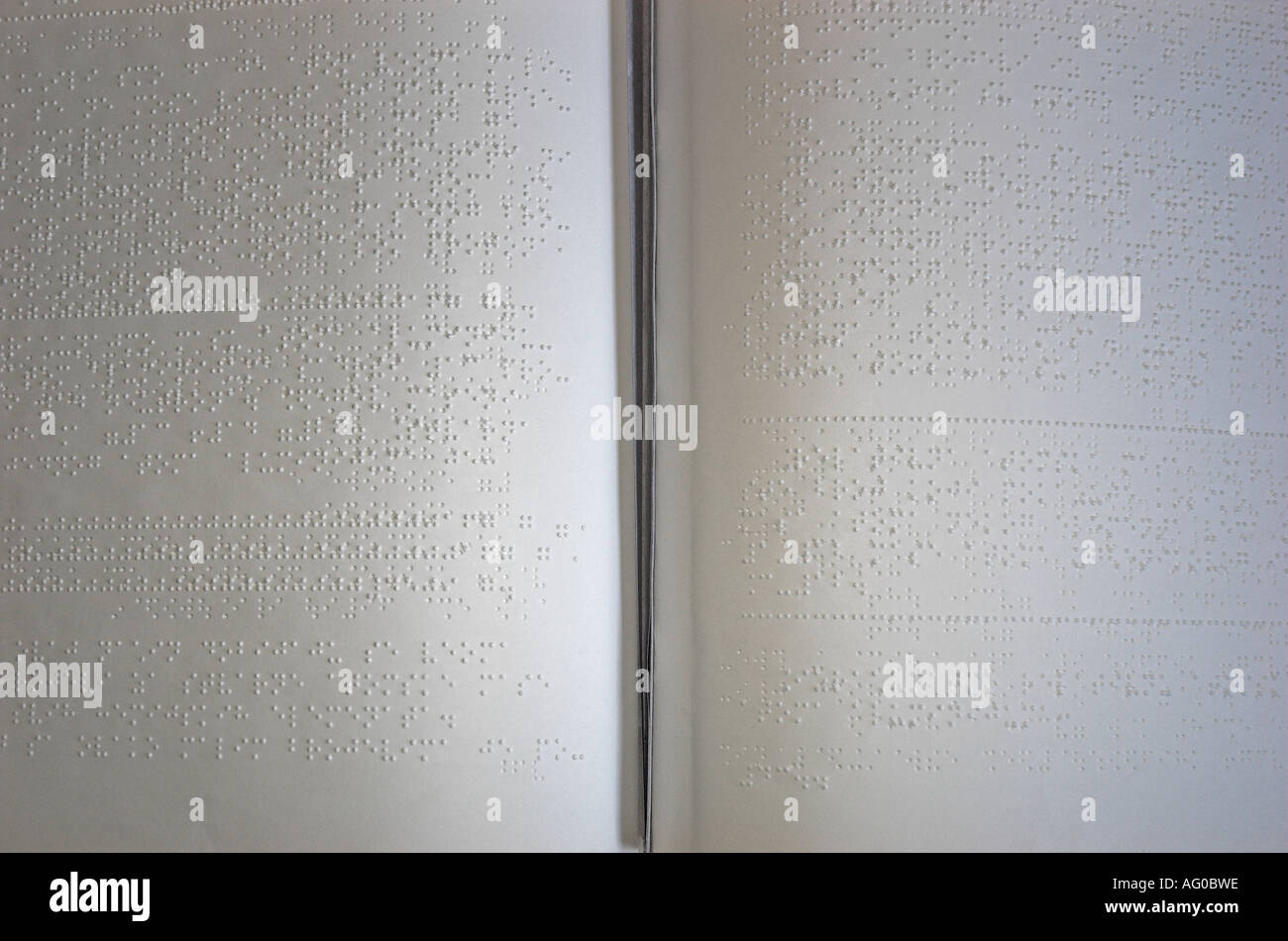 Open book with brail on pages Stock Photo - Alamy