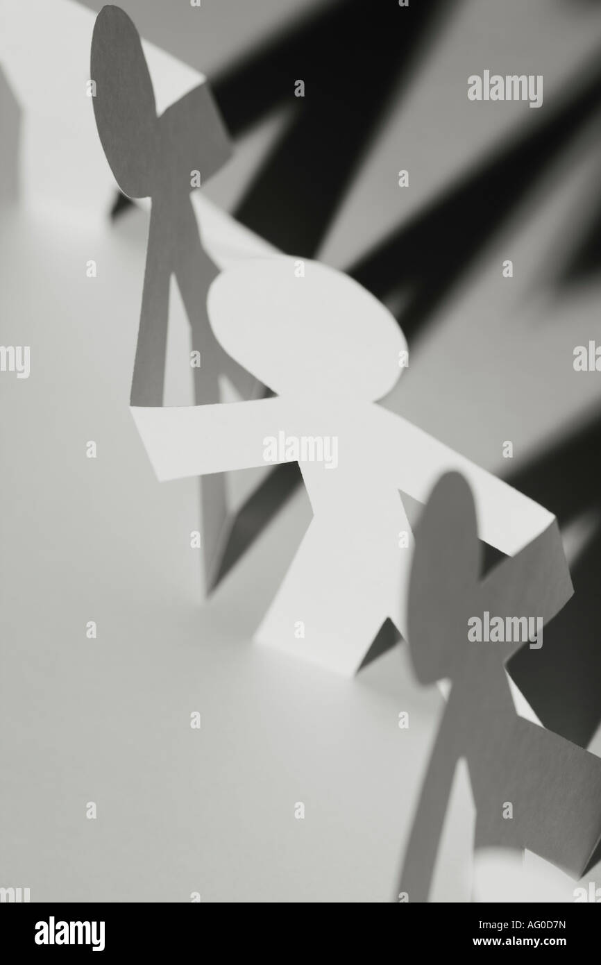 Paper dolls holding hands hi-res stock photography and images - Alamy