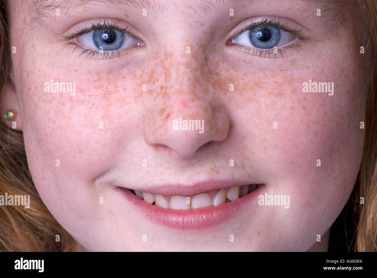 A smiling freckle faced 11 year old Australian girl of Irish origin ...