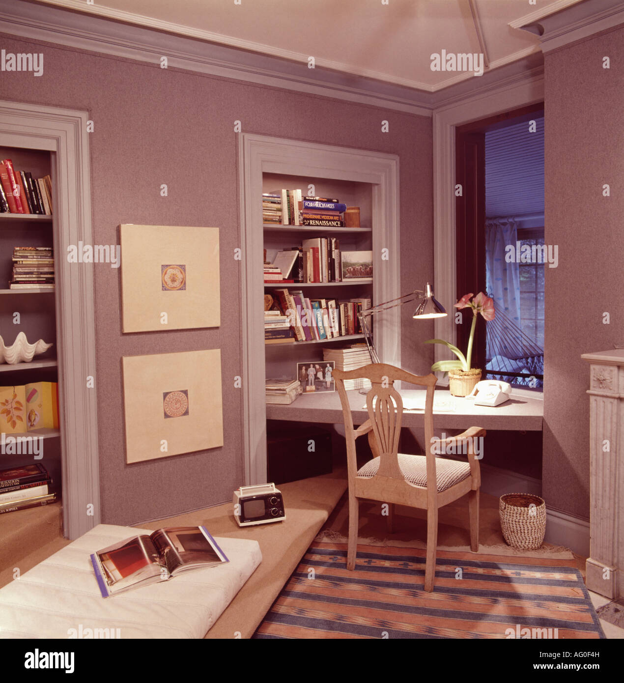 Built in desk and alcove shelving in eighties study with miniature ...